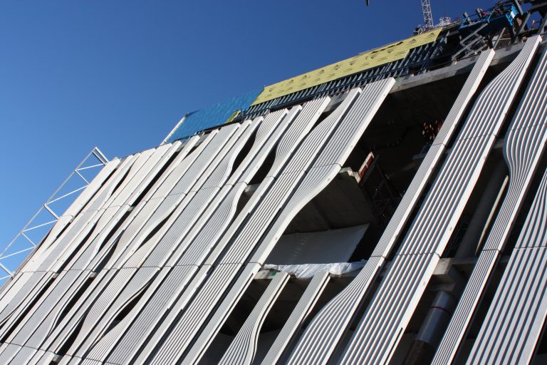 WHITE CONCRETE CLADDING CUSTOM FORM LINER - Surespan